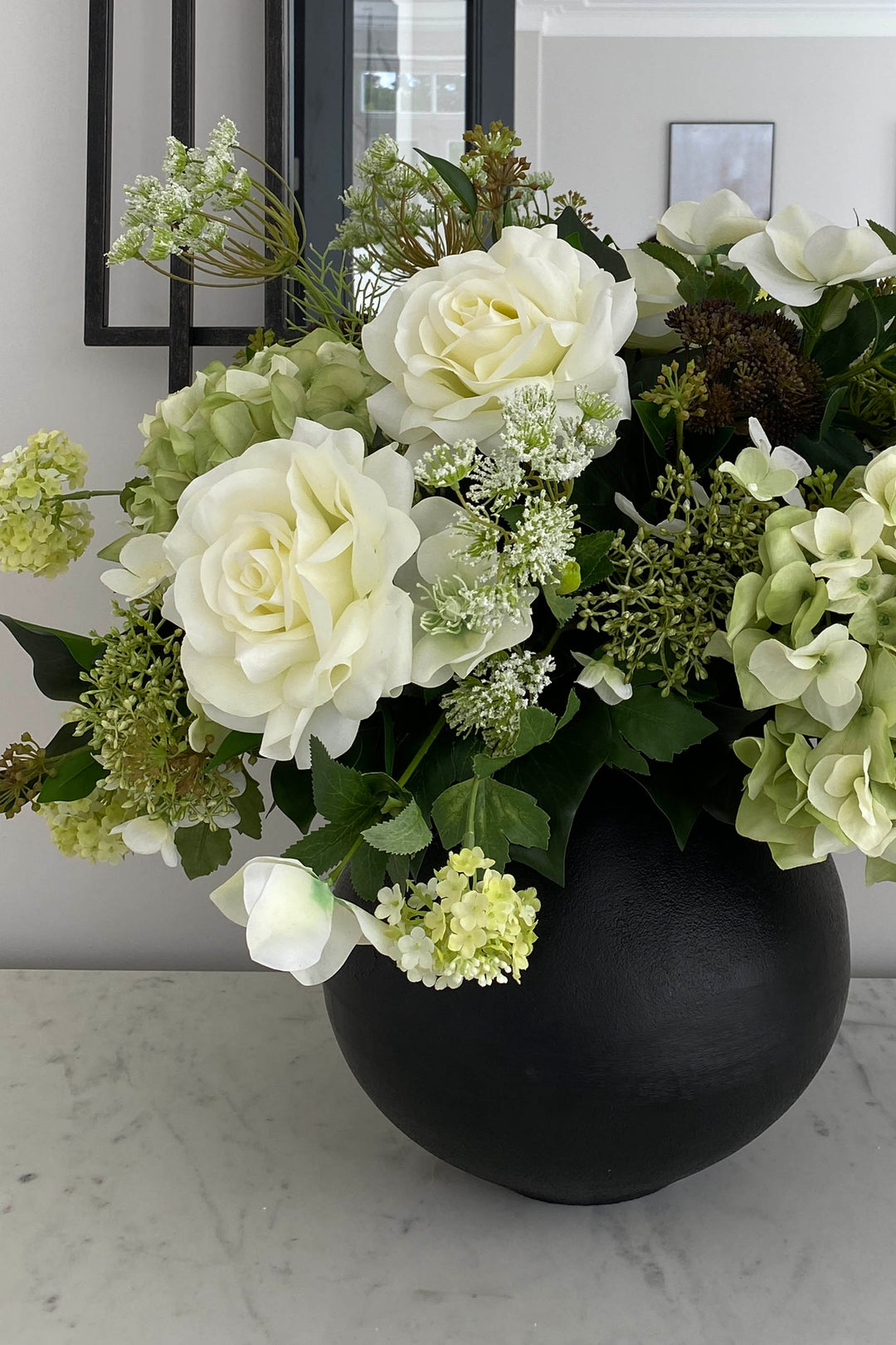 Hellebores, Roses and Snowball in a Black Metal Vase – RTfact Flowers